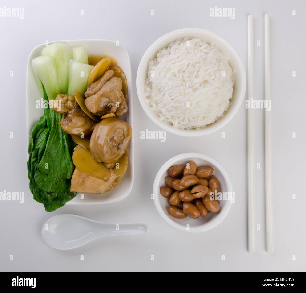 Chicken with rice and vegetables in background Stock Photo - Alamy