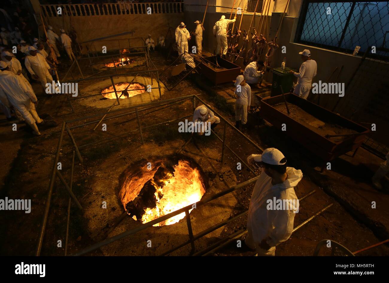 Members of the Samaritan community cook Passover Lambs inside blazing ...