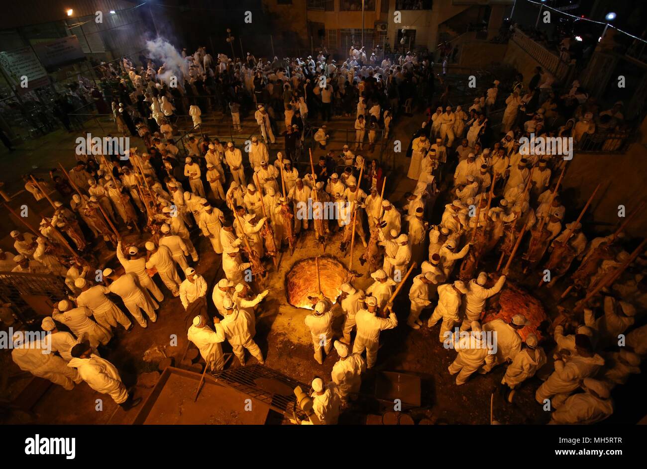 Members of the Samaritan community cook Passover Lambs inside blazing ...