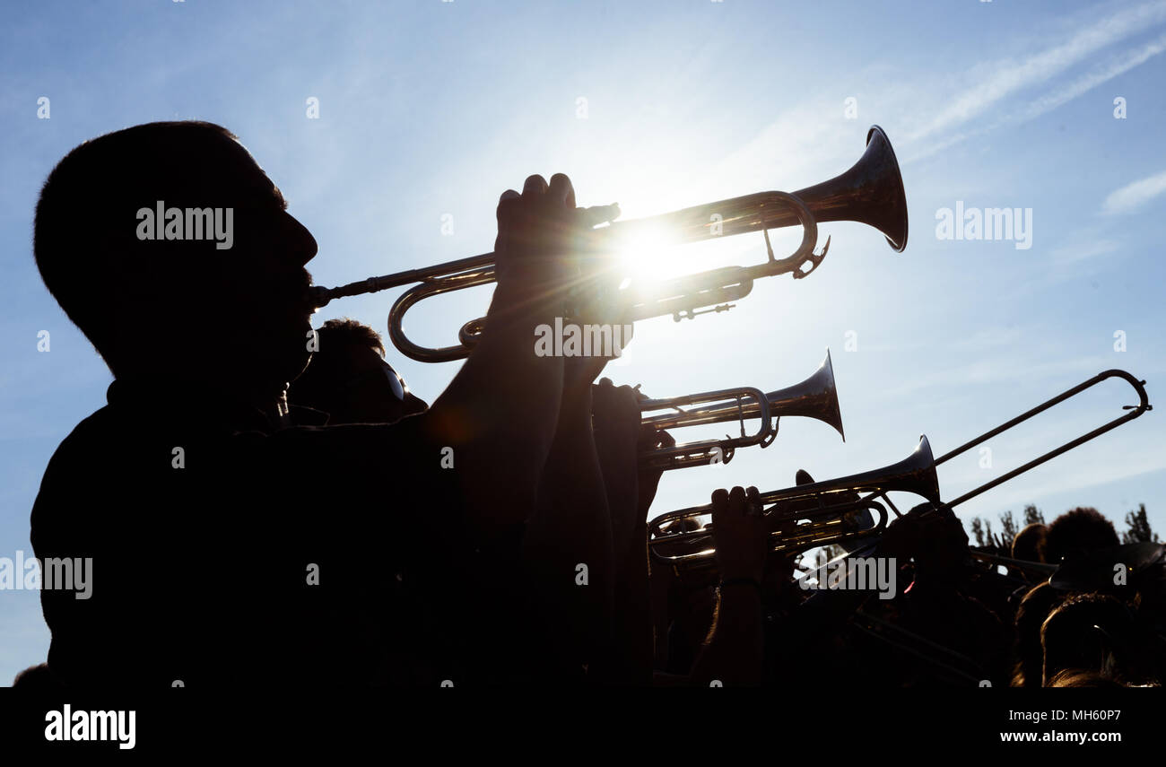 29 April 2018, Germany, Berlin: A group of musicians plays the trumpet ...