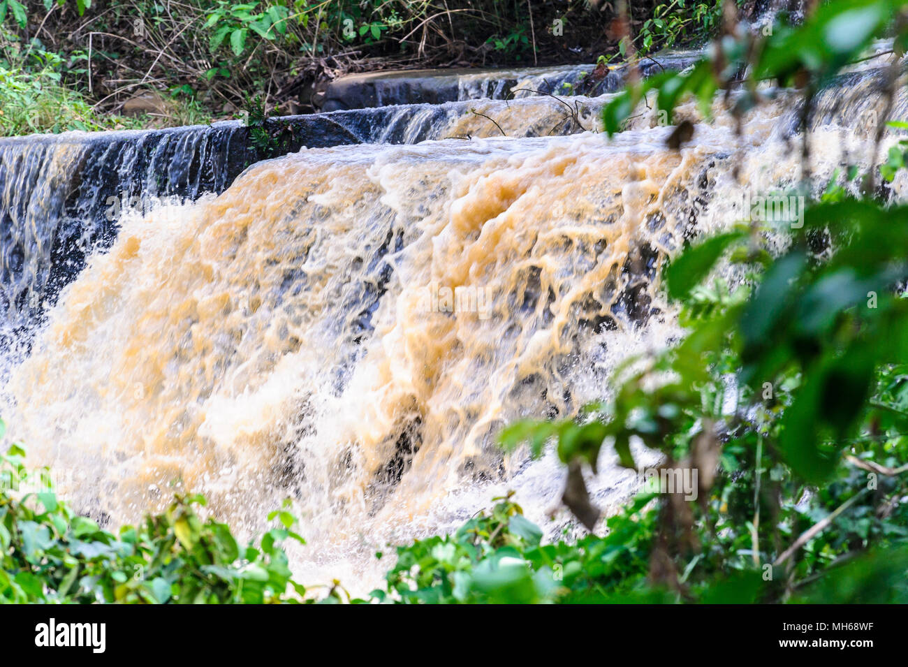 Waterfall of red water in Ghana, Africa Stock Photo - Alamy
