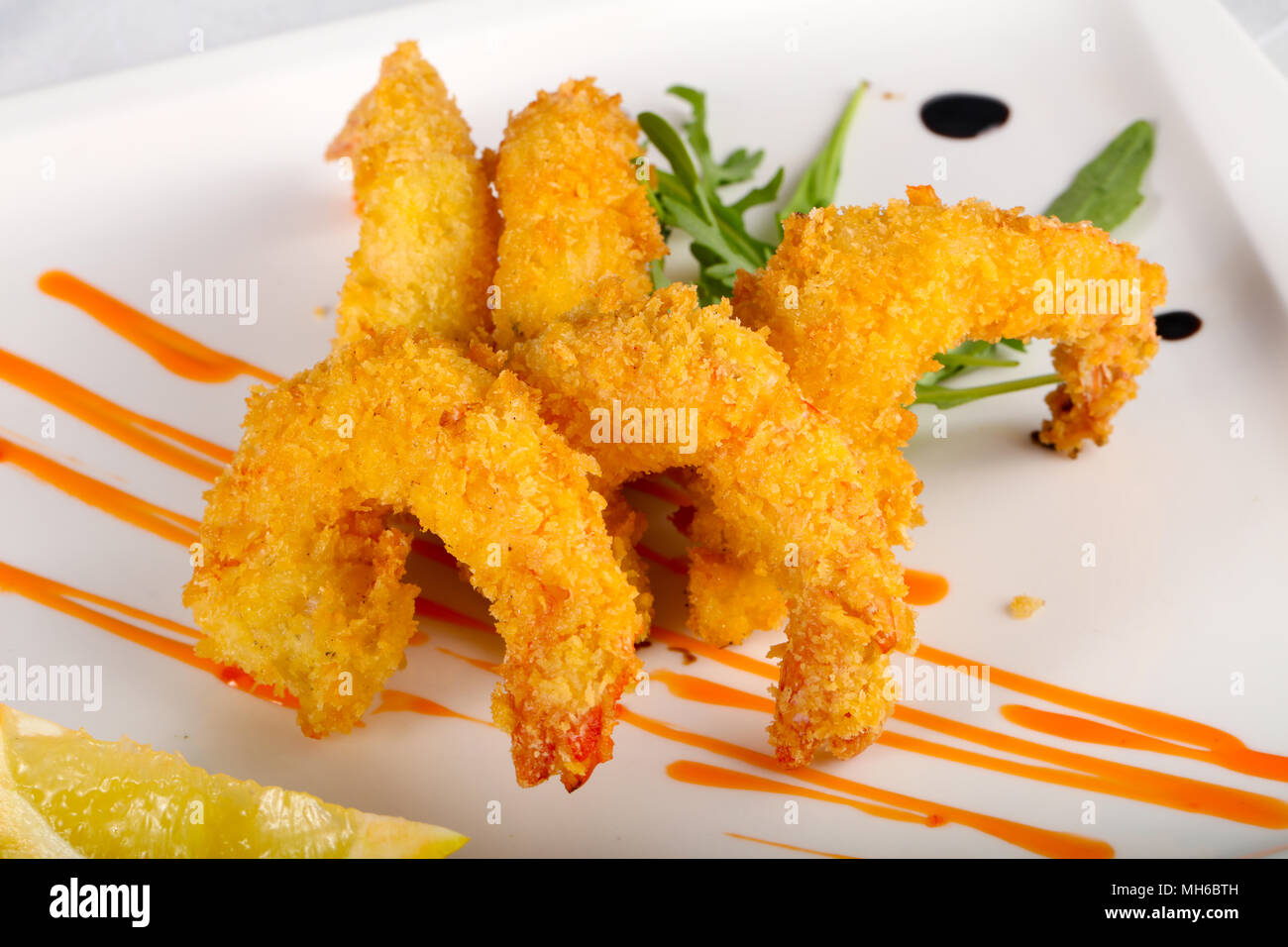 Crispy prawns served lemon slice Stock Photo - Alamy