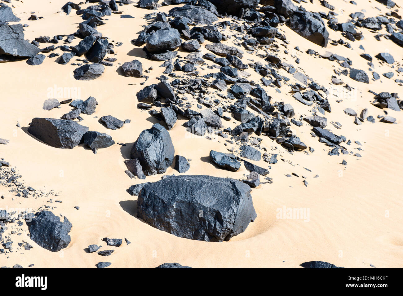 Black rocks of the Black Desert in Egypt Stock Photo - Alamy