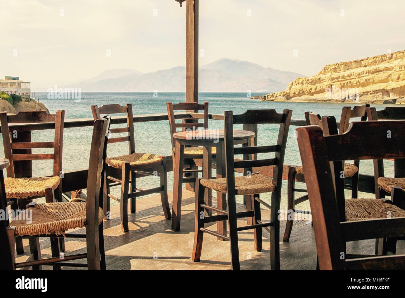 Outdoor restaurant on the beach of Matala, Crete in Greece Stock Photo ...