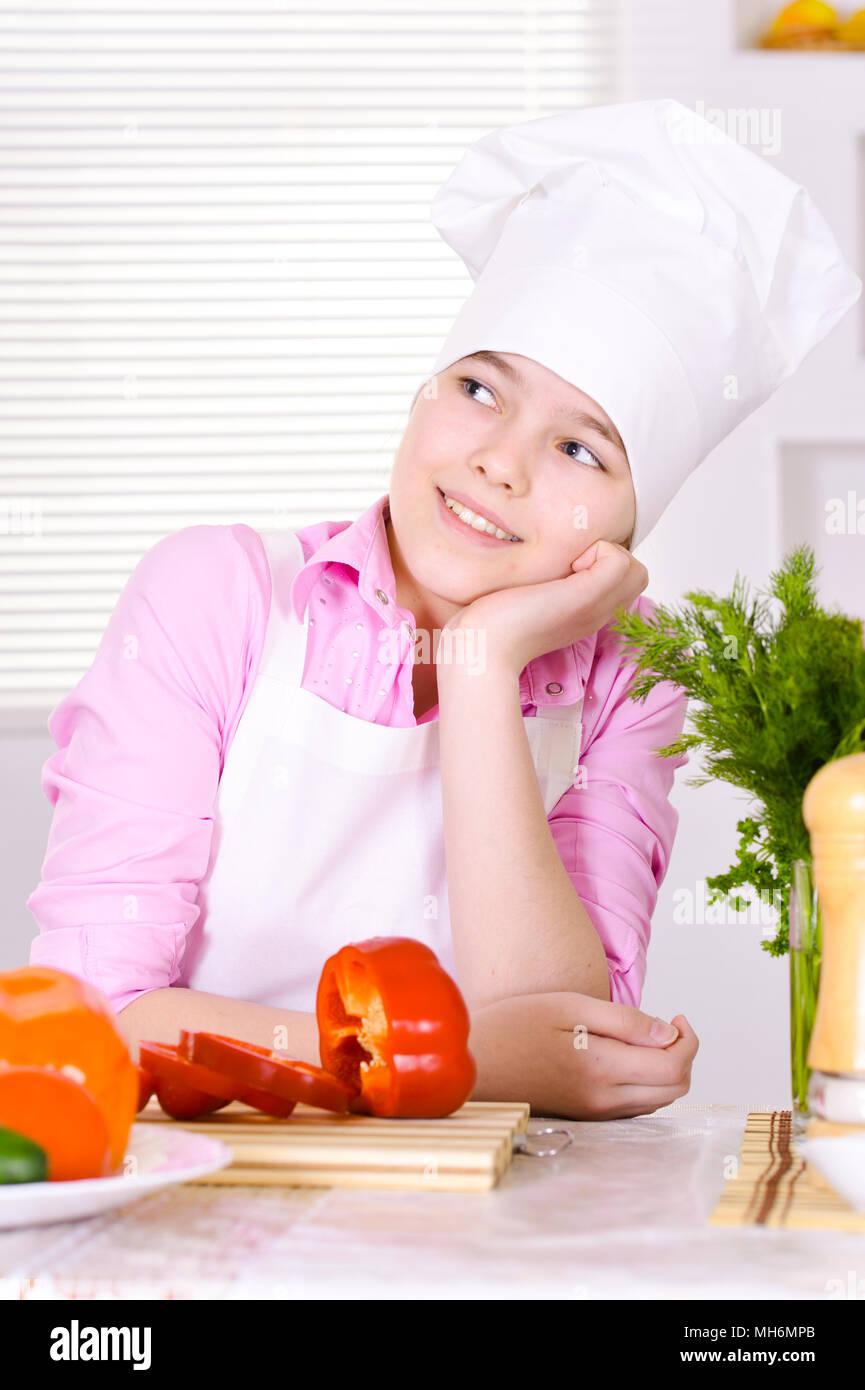 beautiful girl wearing chef uniform with vegetables Stock Photo - Alamy