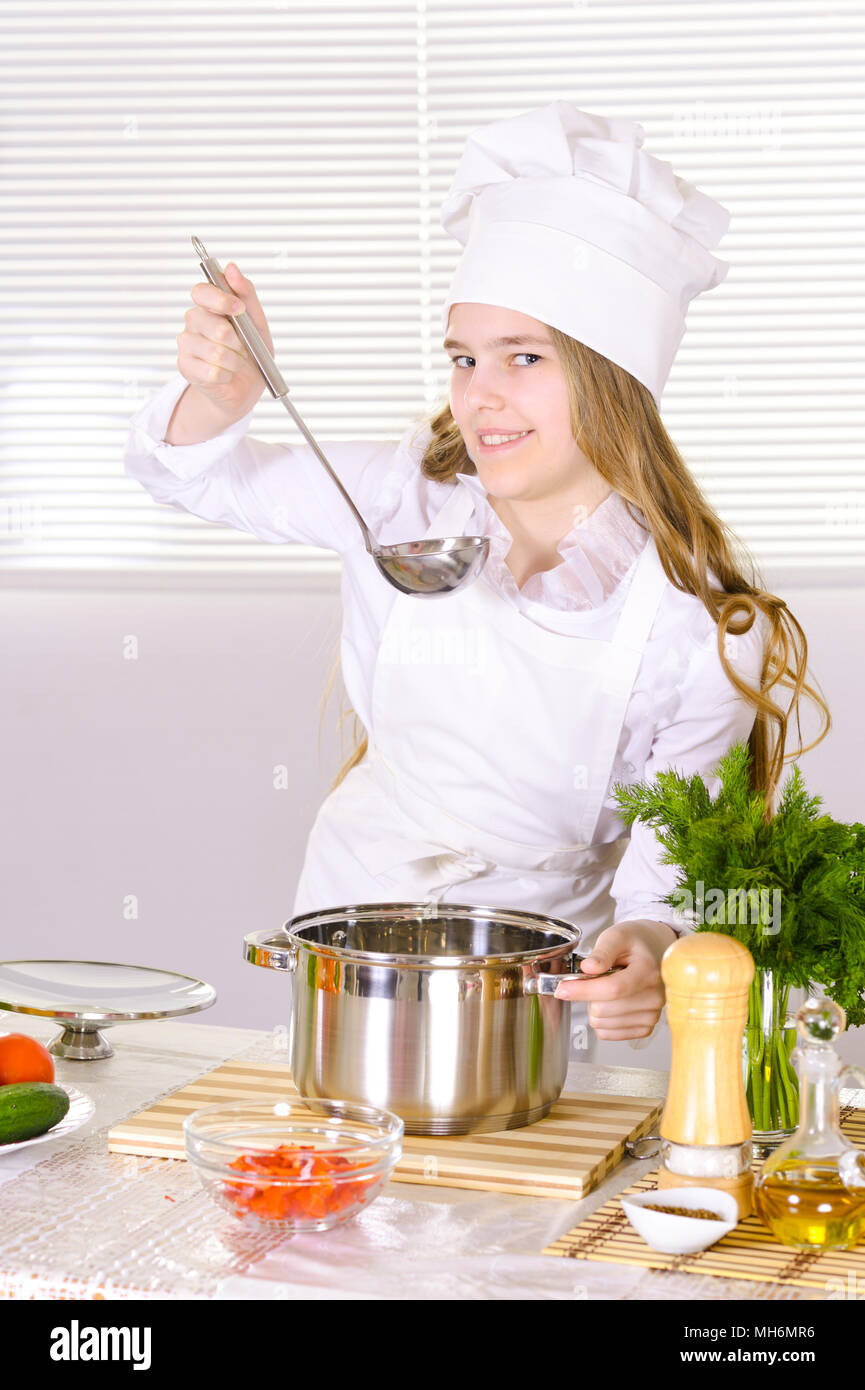 beautiful girl wearing chef uniform cooking on kitchen Stock Photo - Alamy