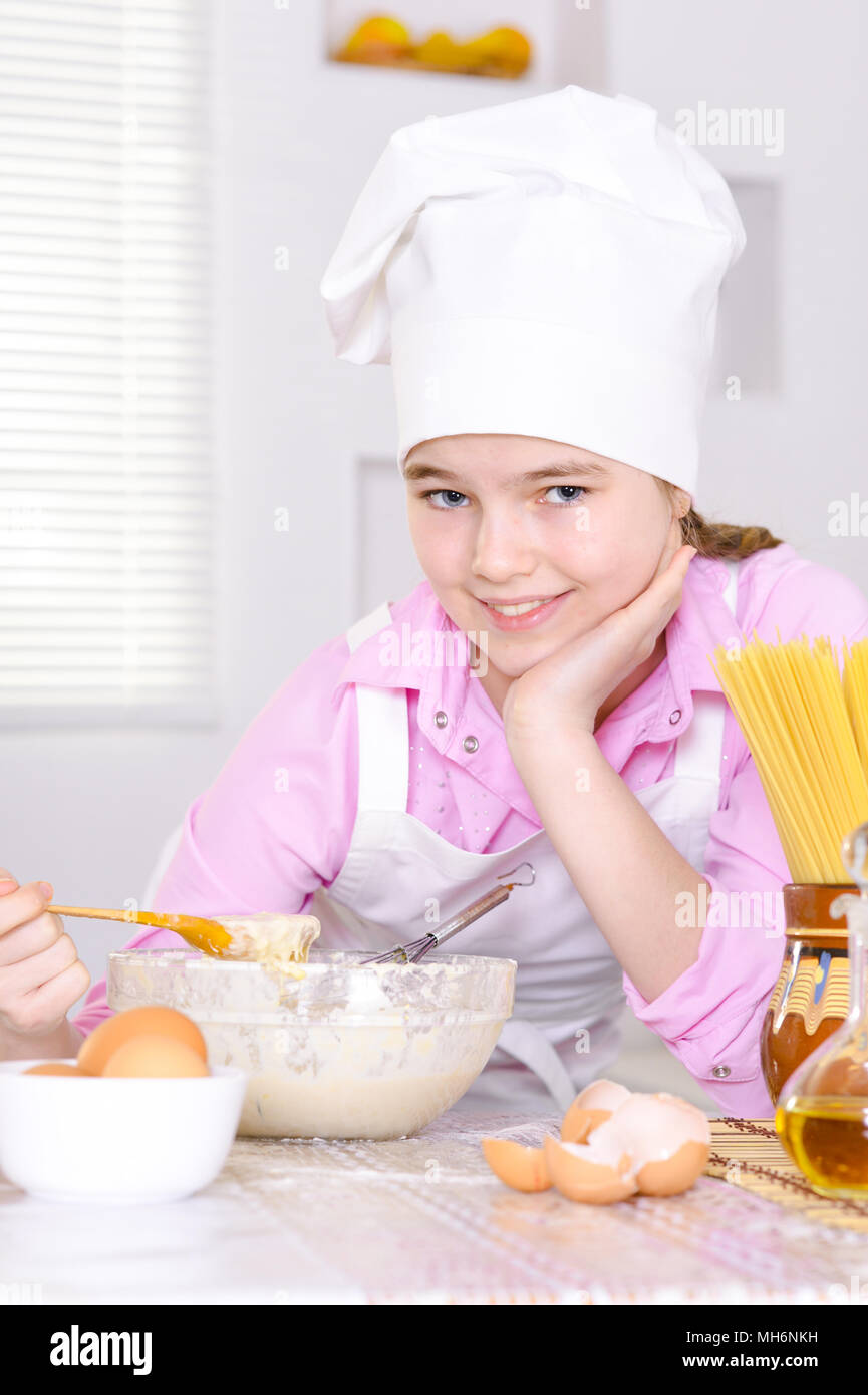 Cute girl cooking in the kitchen Stock Photo - Alamy
