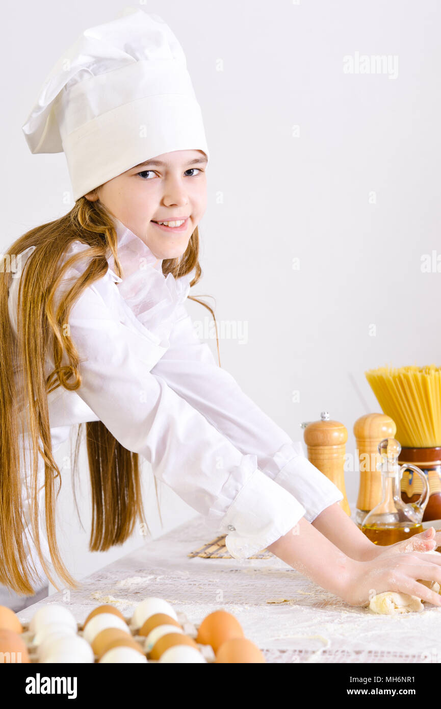 Cute girl baking in the kitchen Stock Photo - Alamy