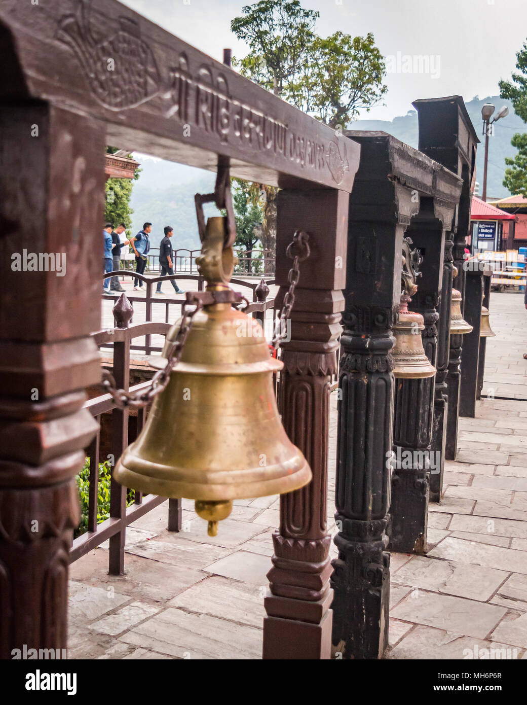 In Hinduism, bells are generally hung at the temple dome in front of ...