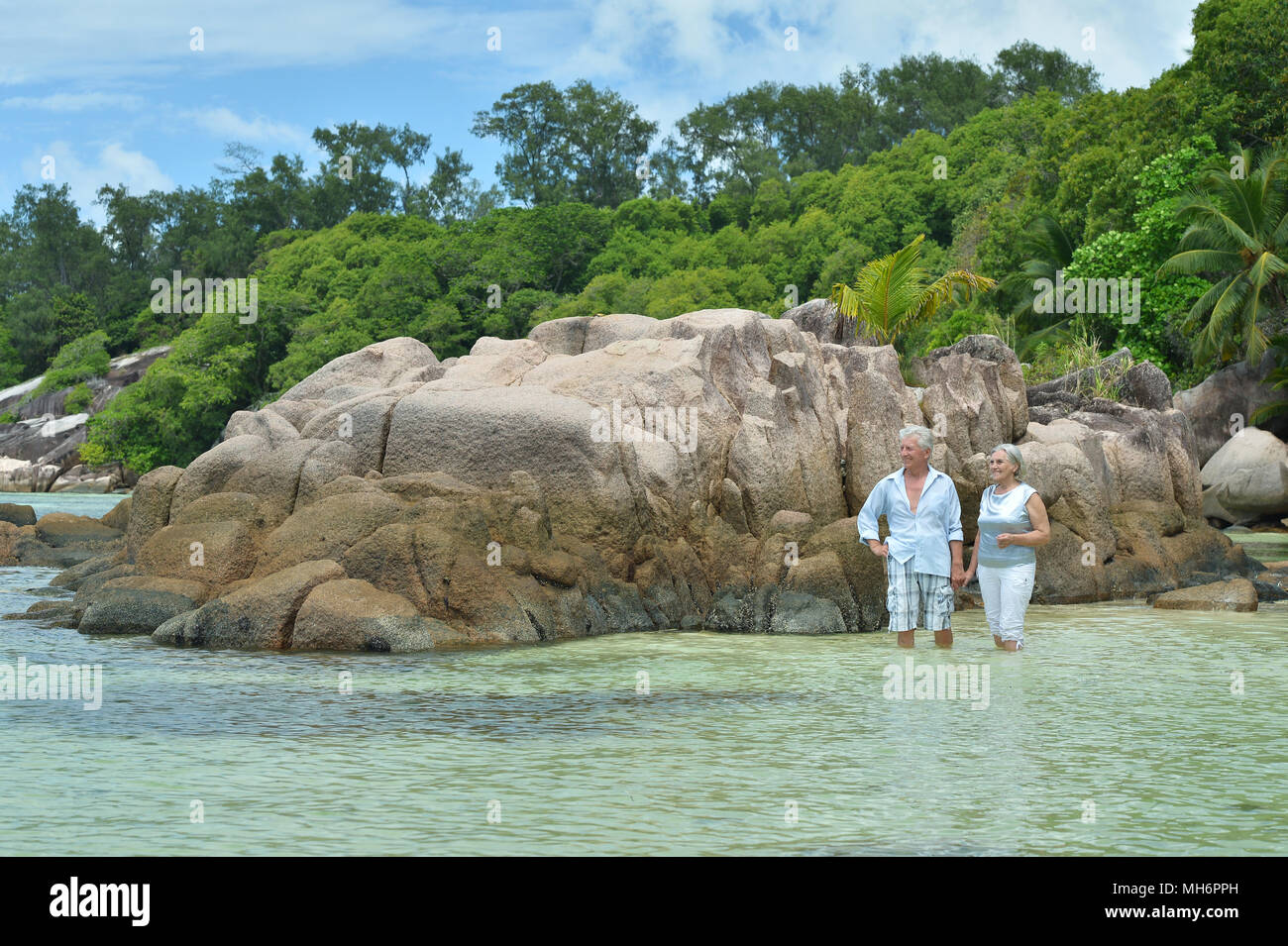 elderly couple rest at tropical resort Stock Photo - Alamy