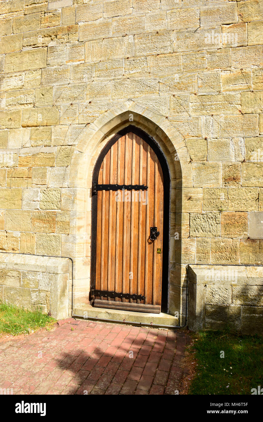A church door with the pointed arch of Roman design, Southern England ...