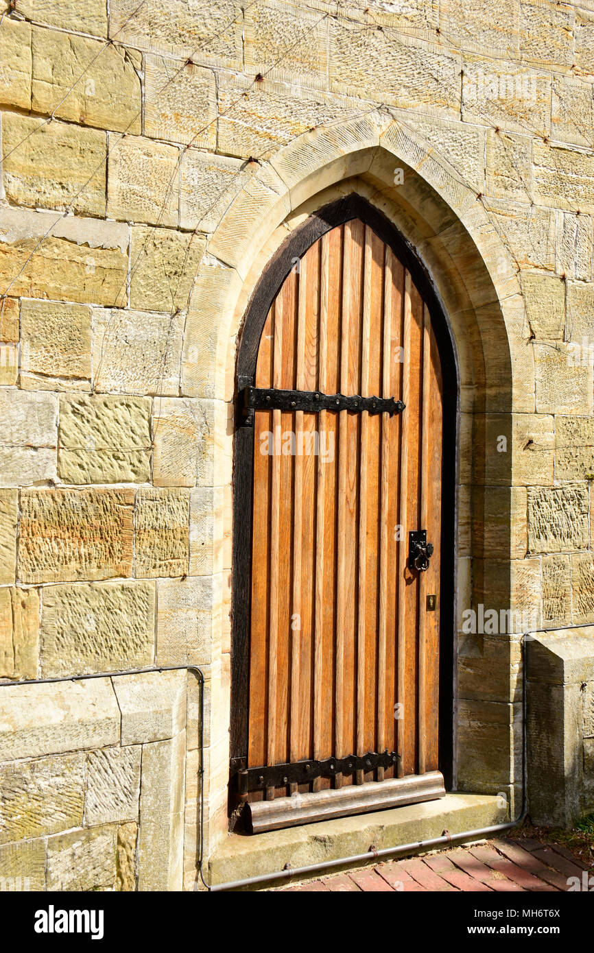 A church door with the pointed arch of Roman design, Southern England ...