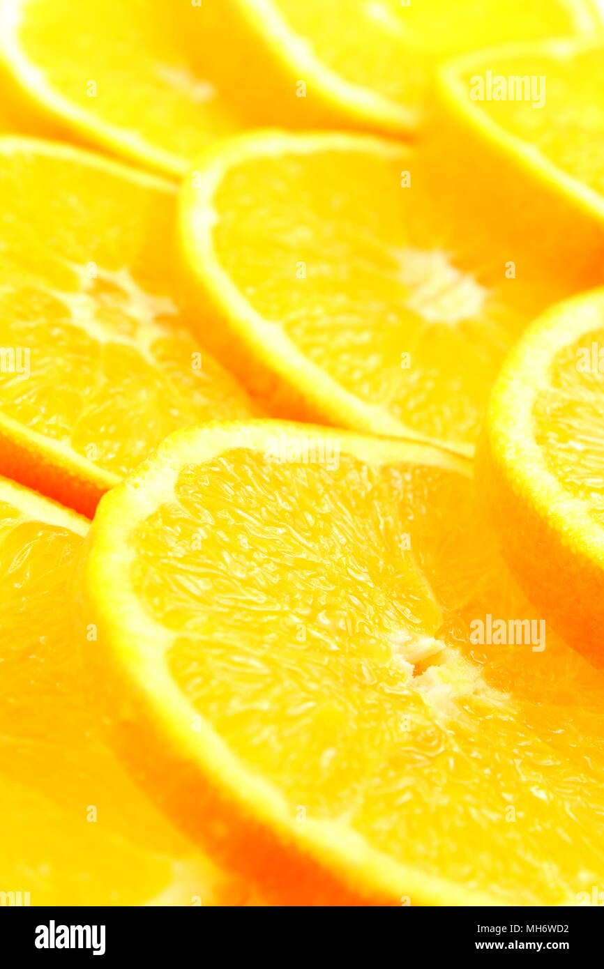 slices of fresh orange fruits as a food background texture Stock Photo ...