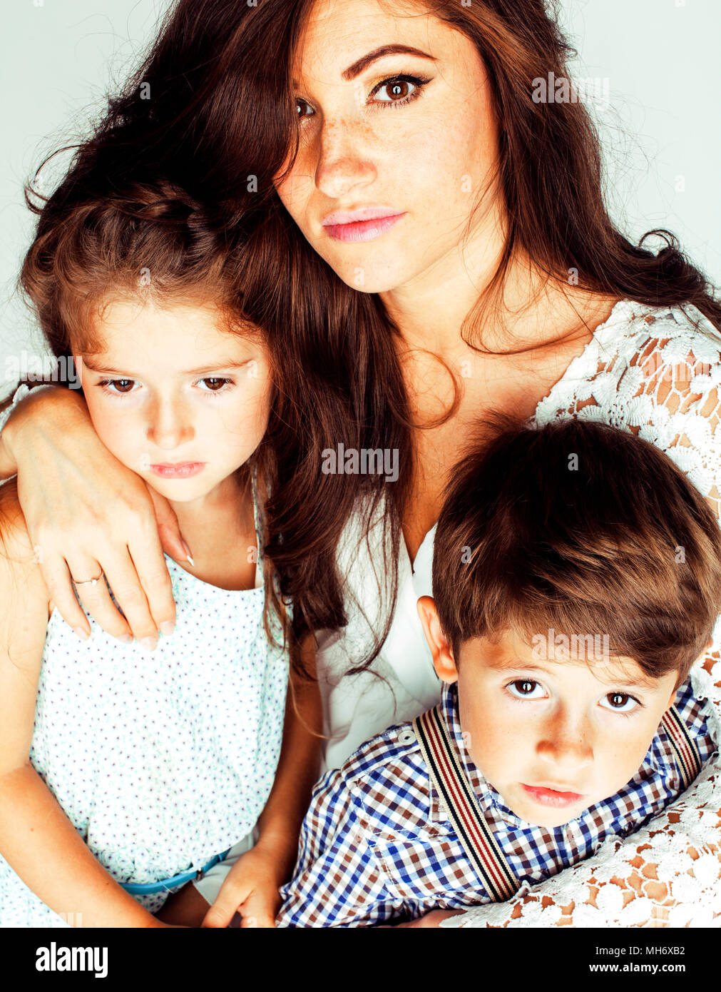 young mother with two children on white background, happy smilin Stock ...