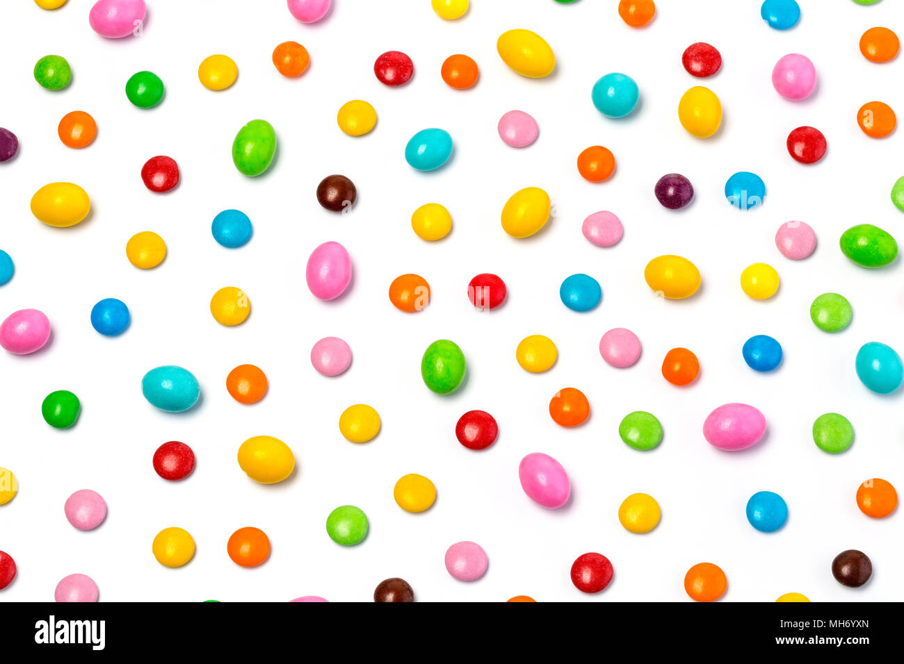 Colorful chocolate candy pills isolated on white background. Top view ...