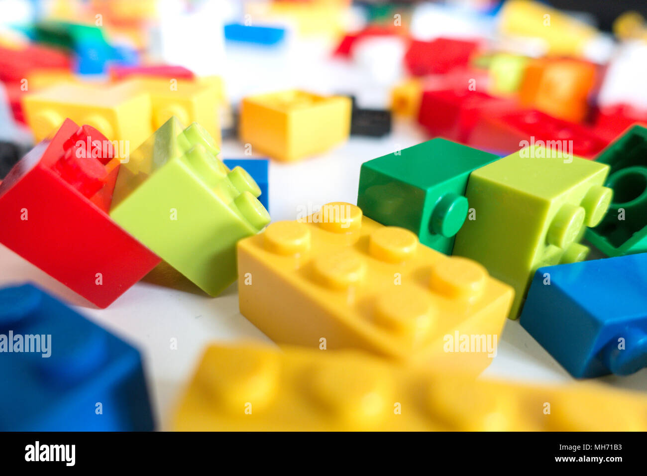 Bright colorful building blocks on white background Stock Photo - Alamy