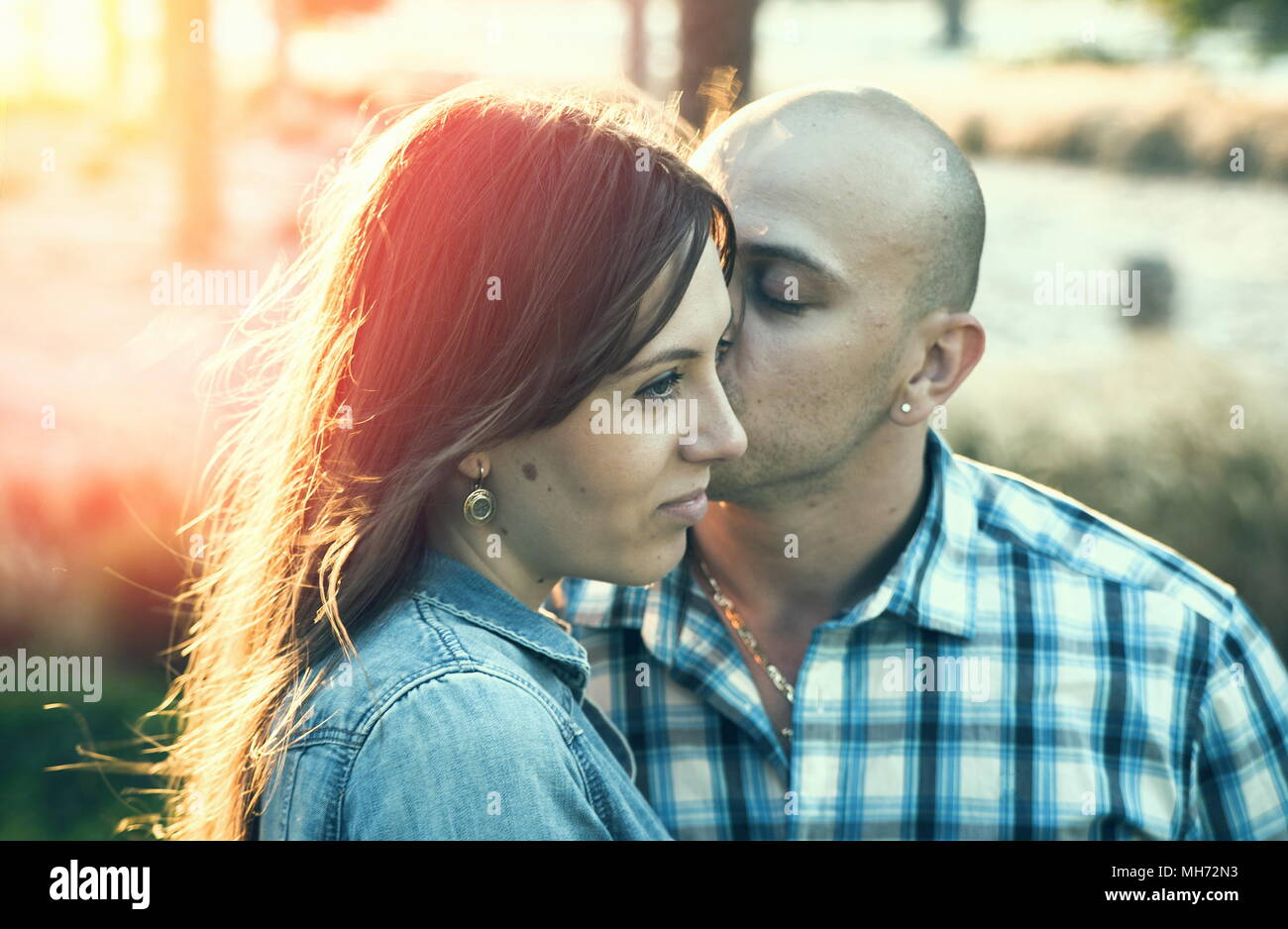 Happy couple in the sunlight Stock Photo - Alamy