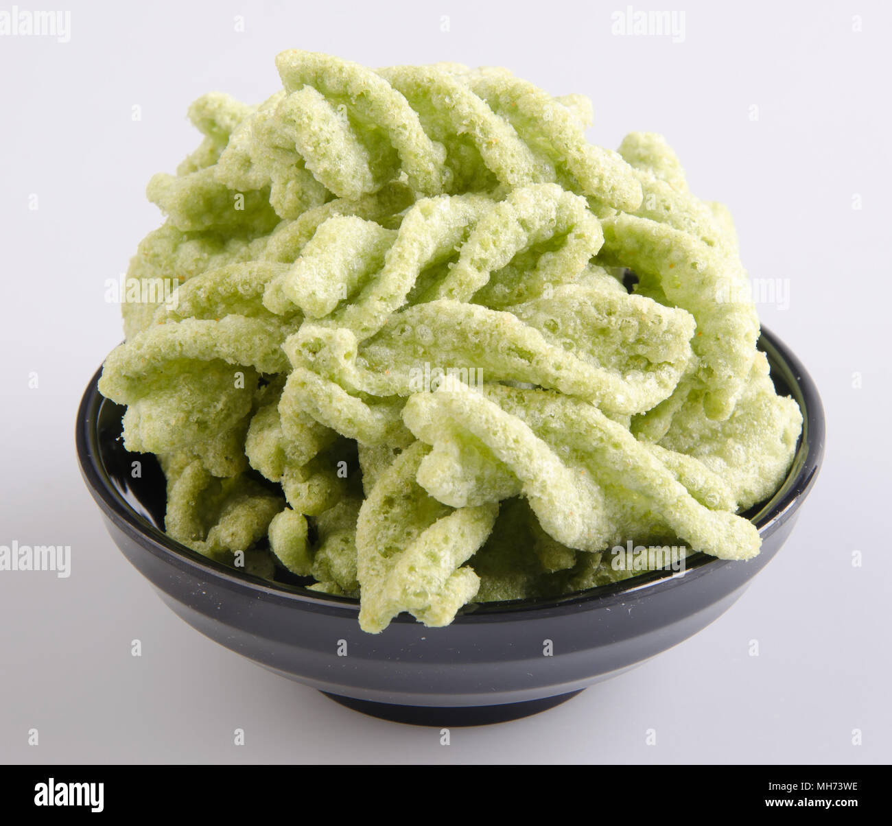 Junk food, green peas snack on a background Stock Photo - Alamy