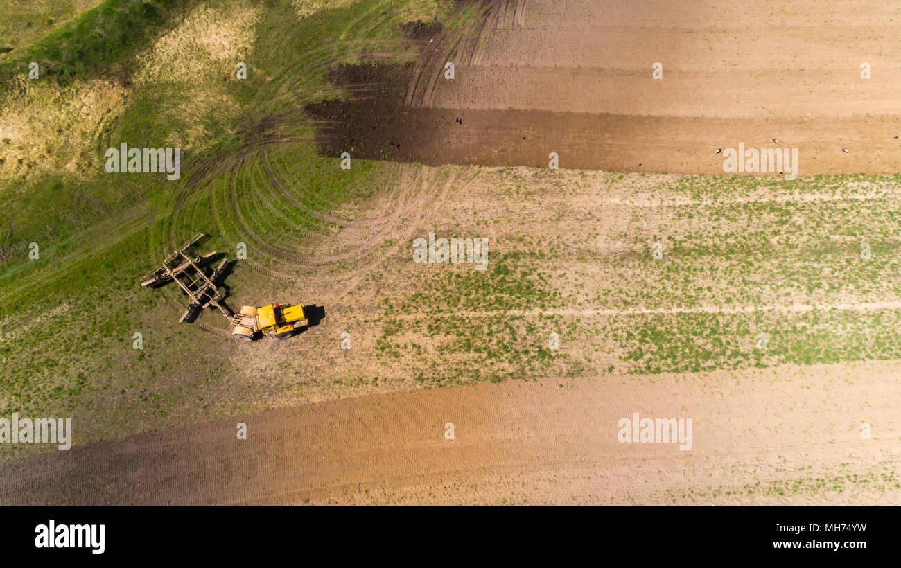 Aerial view of a tractor on a field Stock Photo - Alamy