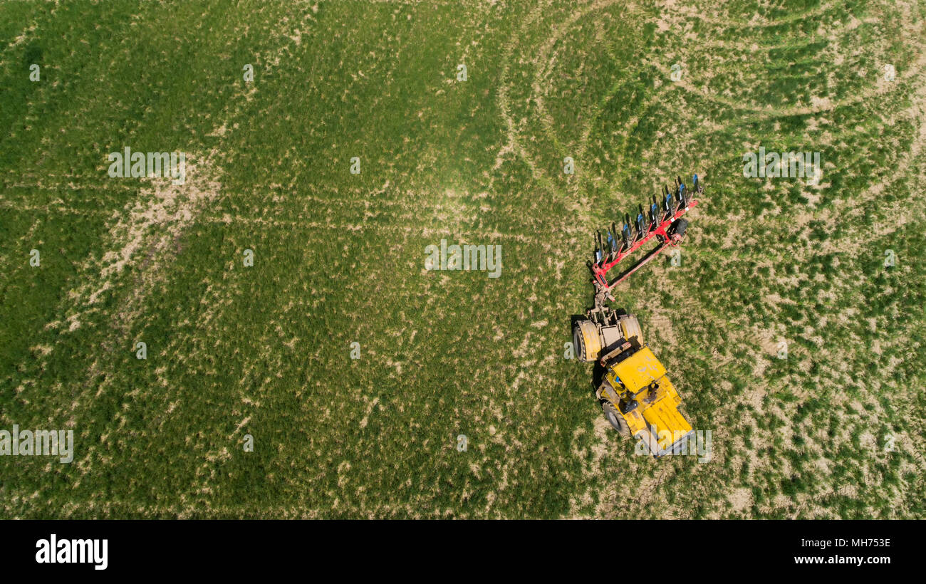 Aerial view of a tractor on a field Stock Photo - Alamy