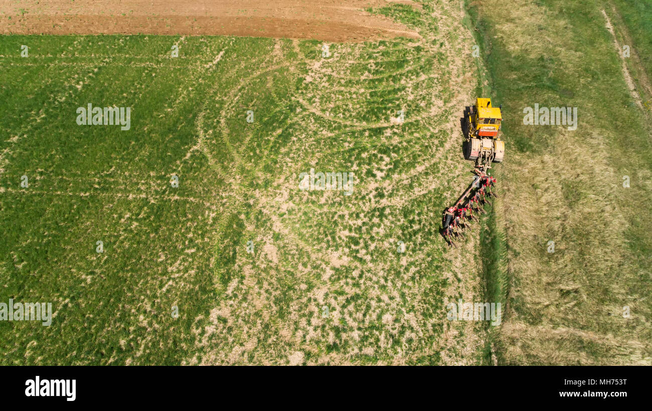 Aerial view of a tractor on a field Stock Photo - Alamy