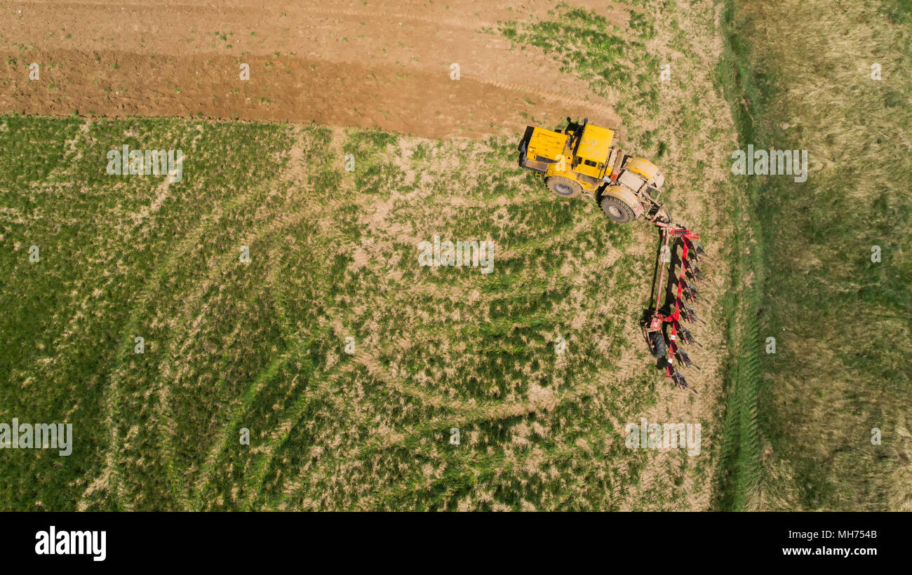 Aerial view of a tractor on a field Stock Photo - Alamy