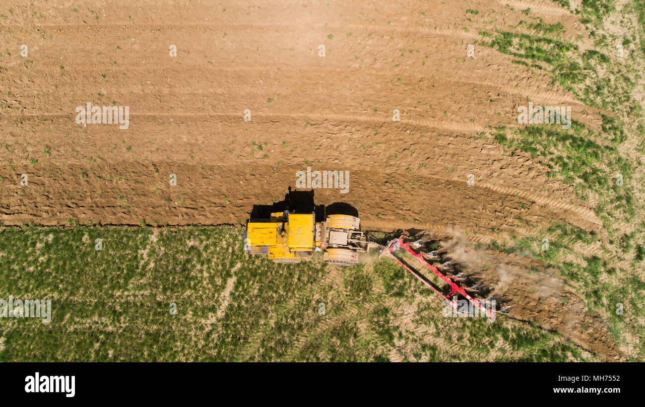 Aerial view of a tractor on a field Stock Photo - Alamy