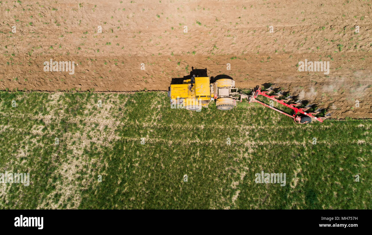 Aerial view of a tractor on a field Stock Photo - Alamy