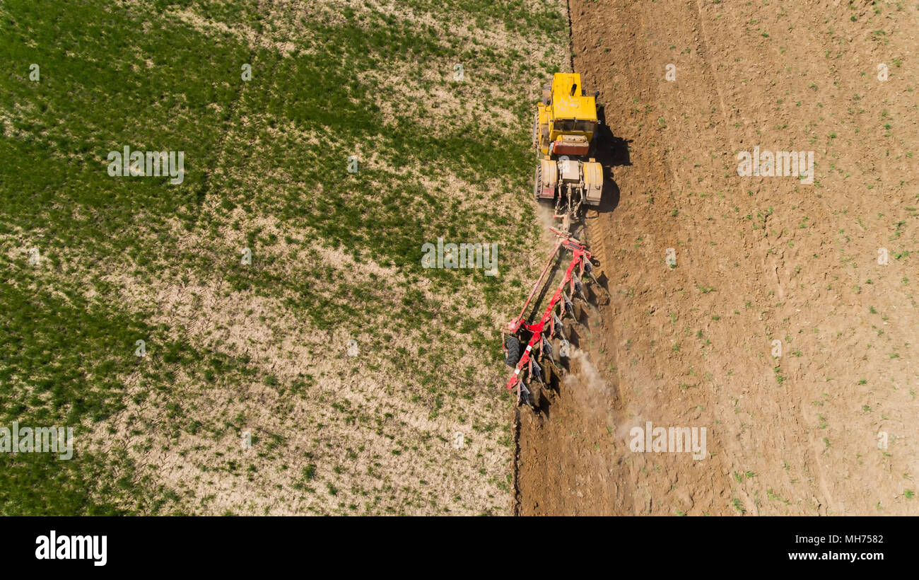 Aerial view of a tractor on a field Stock Photo - Alamy