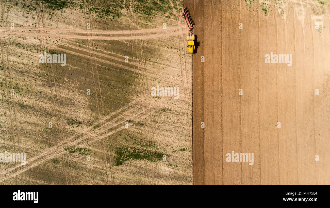 Aerial view of a tractor on a field Stock Photo - Alamy
