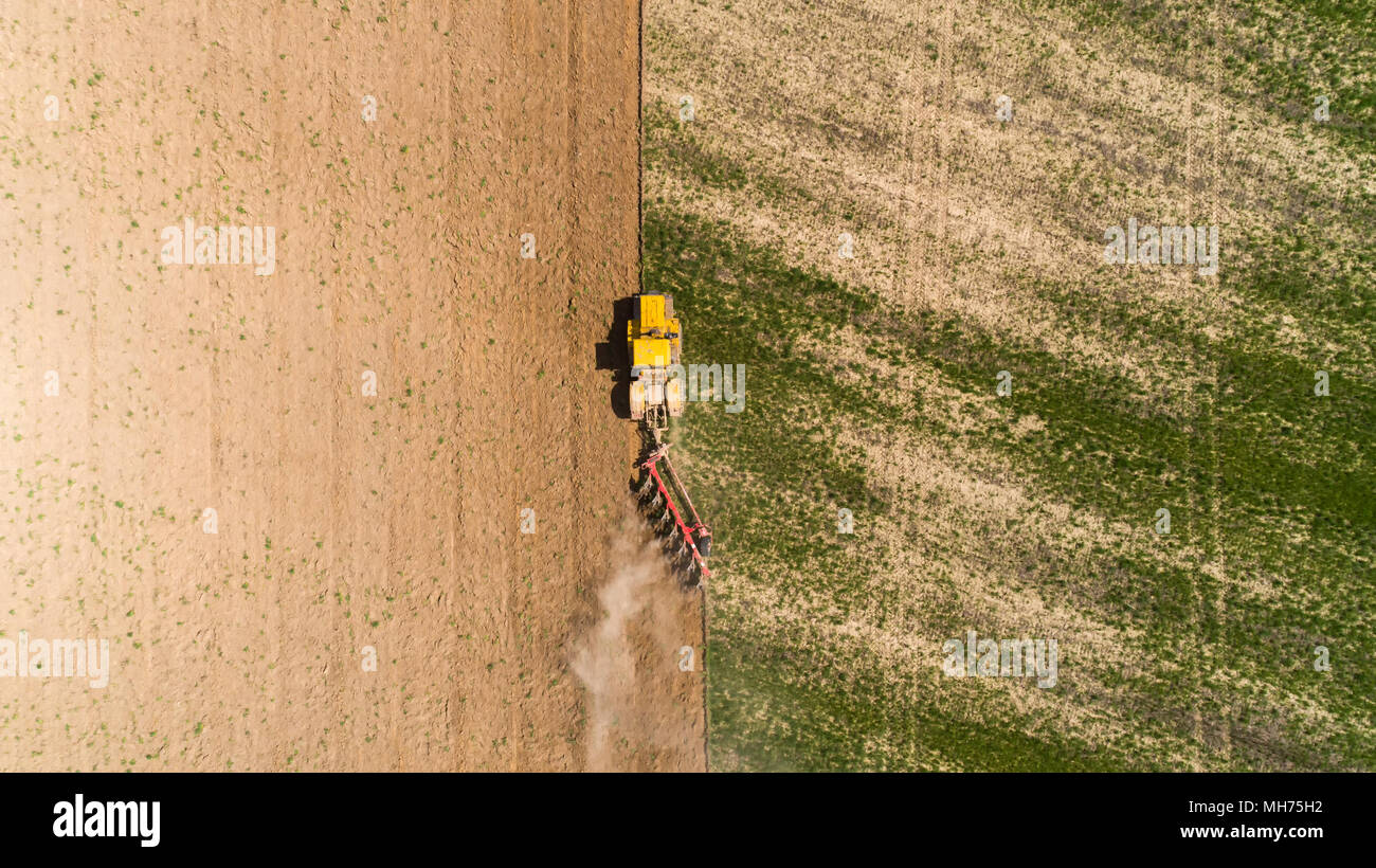 Aerial view of a tractor on a field Stock Photo - Alamy
