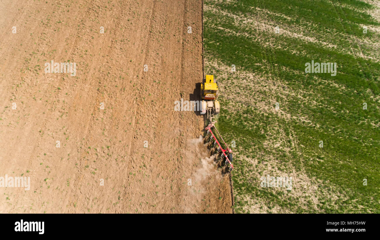 Aerial view of a tractor on a field Stock Photo - Alamy