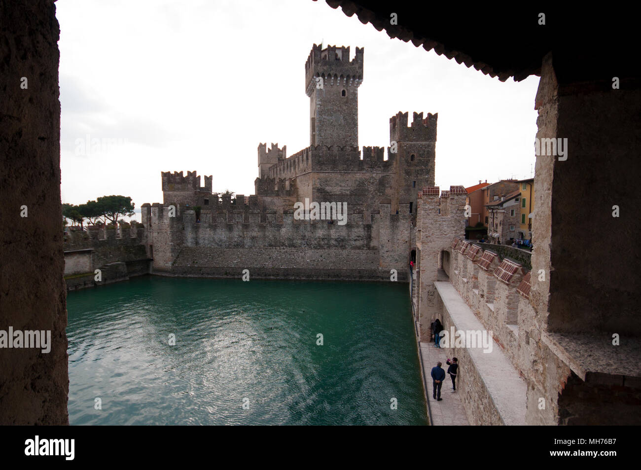 Medieval castle by water Stock Photo - Alamy