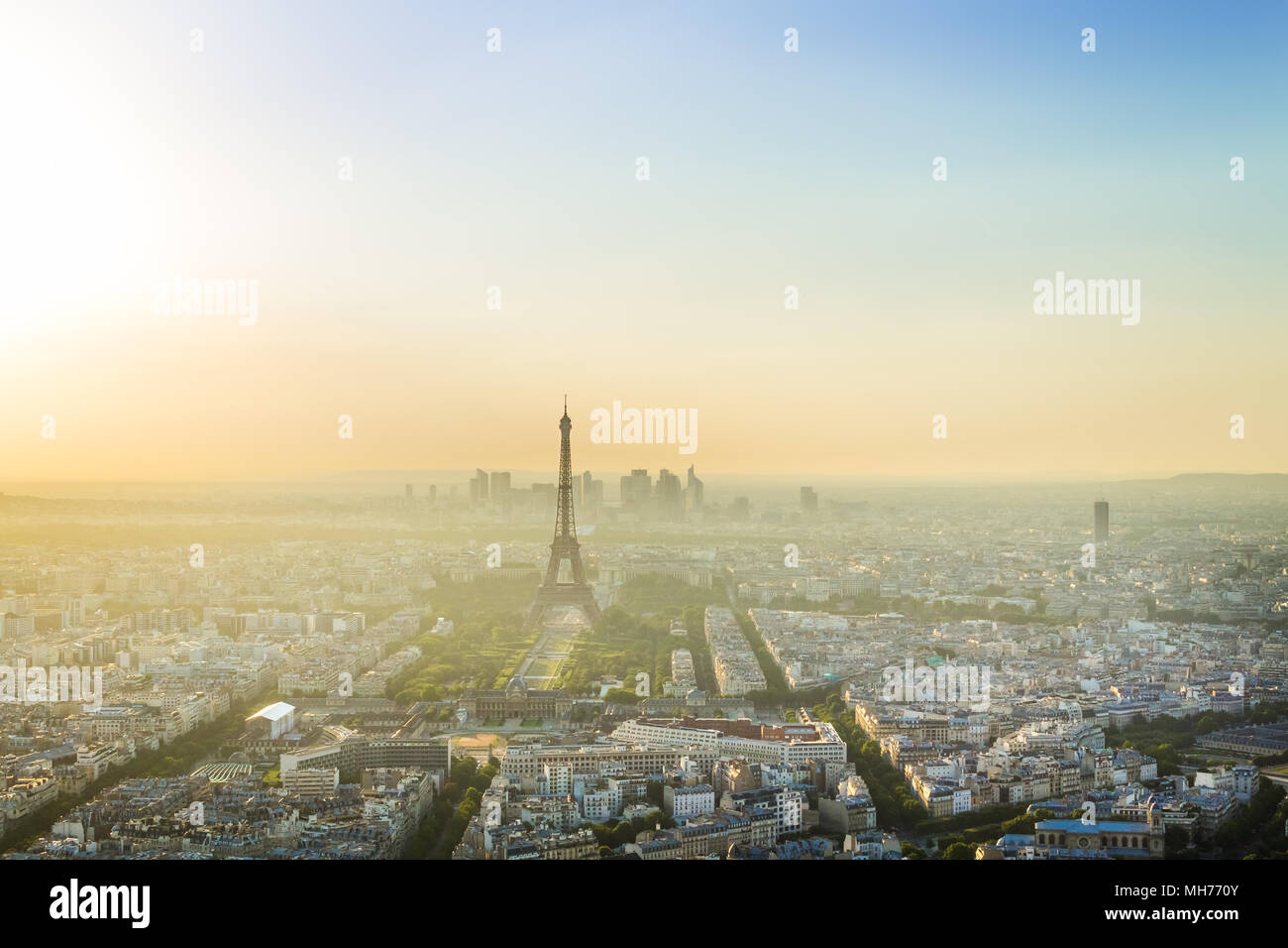 Paris Skyline with Eiffel Tower just before sunset with orange and blue ...