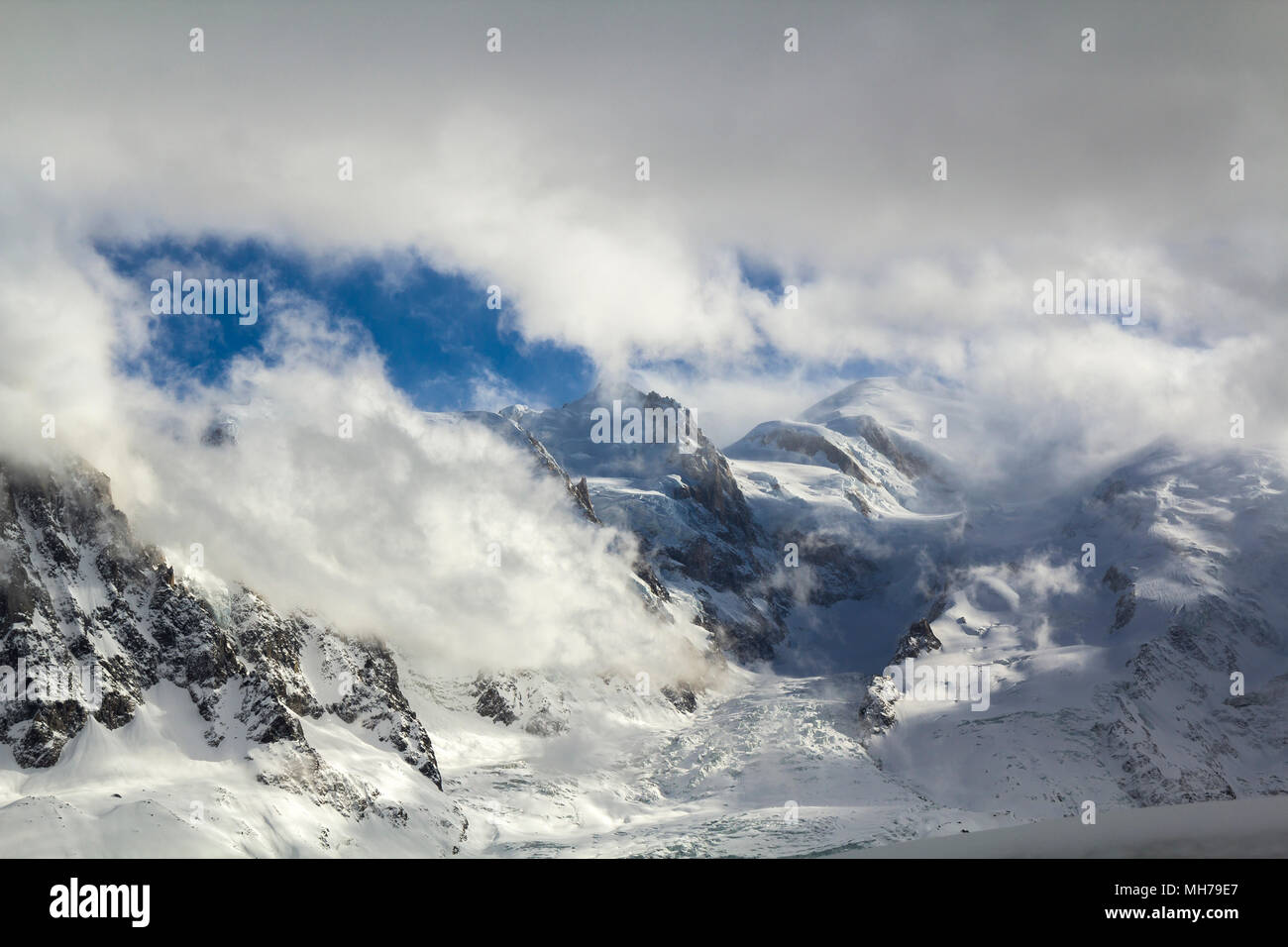 Breathtaking aerial view of Mont Blanc mountain peak covered with shiny ...