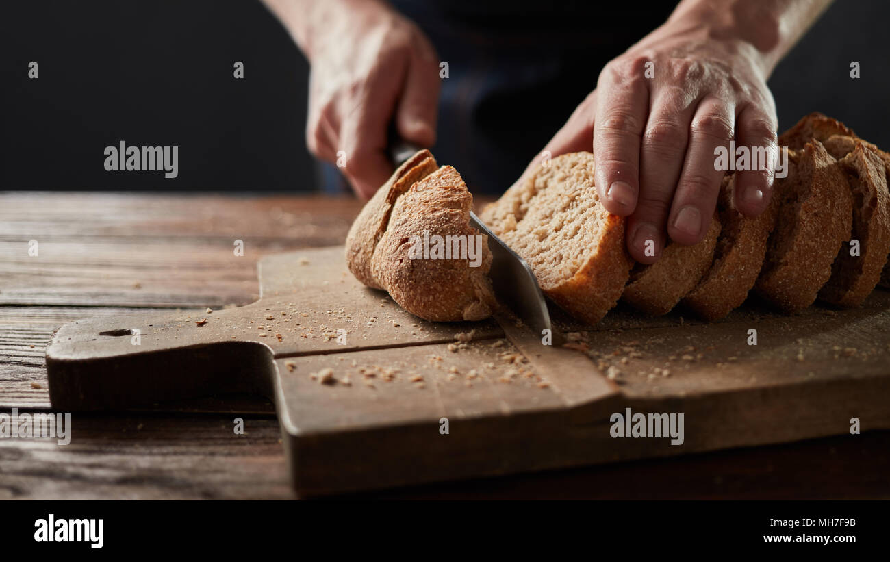 Man baker cutting knife hi-res stock photography and images - Alamy