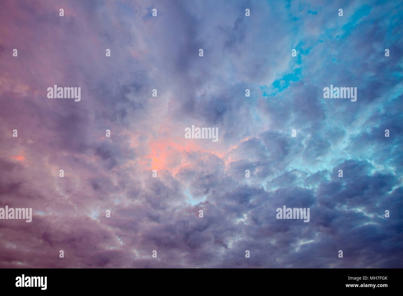 Blue and purple clouds colored by beautiful sunset Stock Photo - Alamy