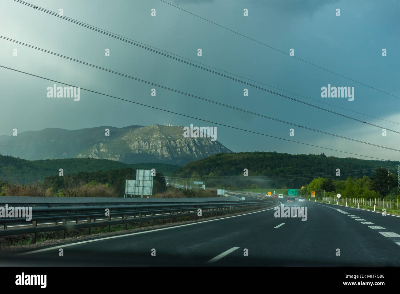Highway leading into storm Stock Photo - Alamy