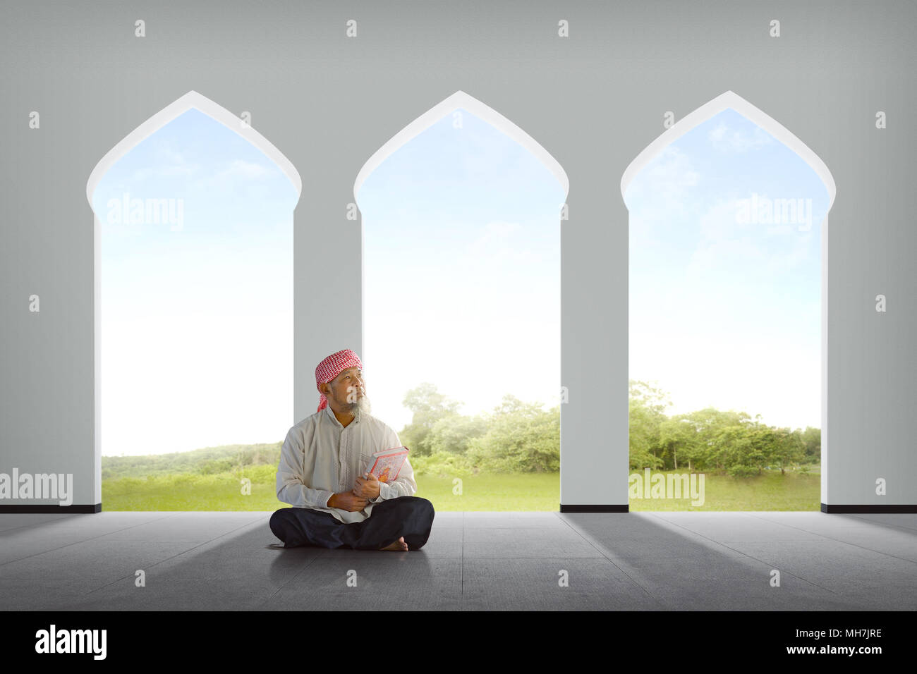 Muslim man reading quran in the mosque hi-res stock photography and ...