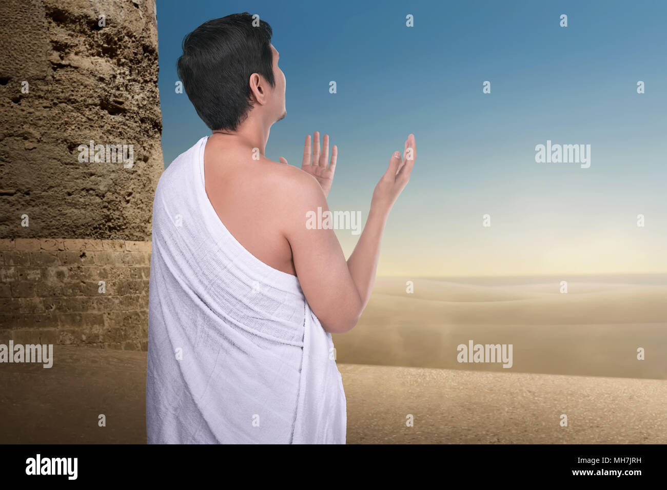 Back view of asian pilgrim man praying to Allah in outdoor Stock Photo ...