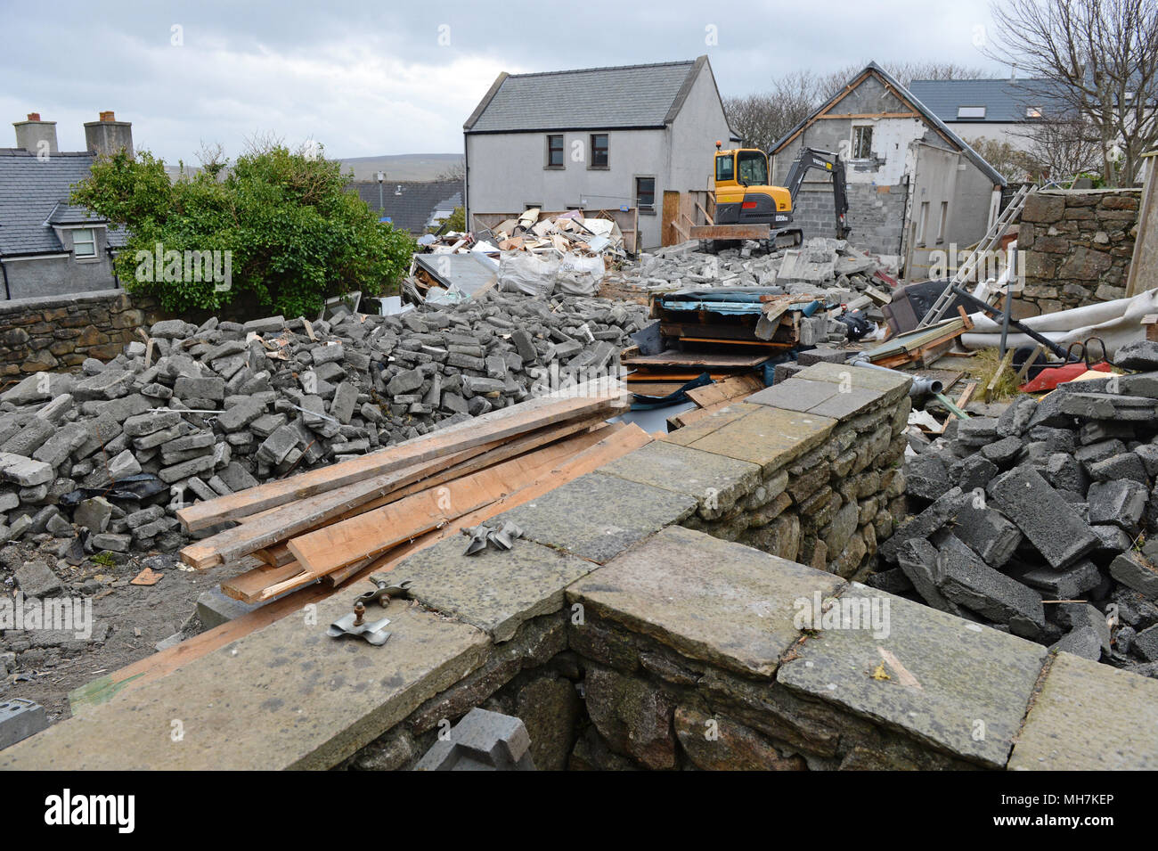 House demolition site with digger and rubble from the demolition Stock ...