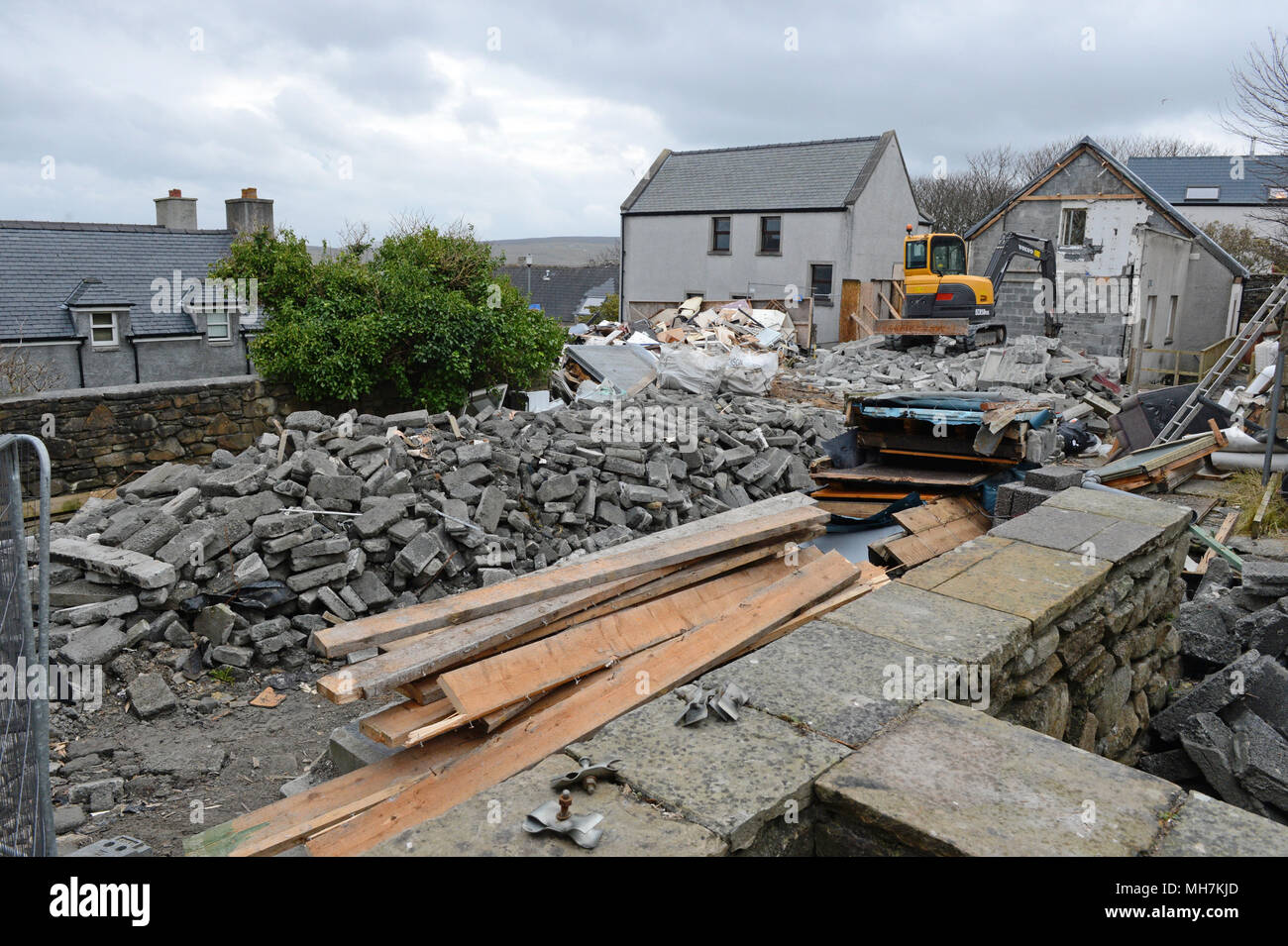 House demolition site with digger and rubble from the demolition Stock ...