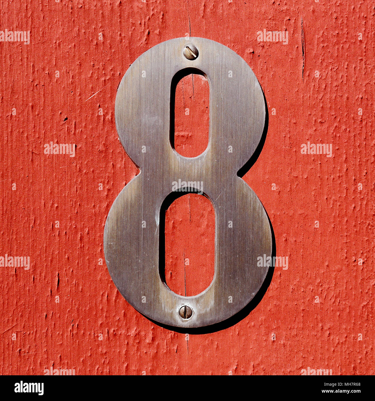 Number eight isolated on a red wooden wall Stock Photo - Alamy