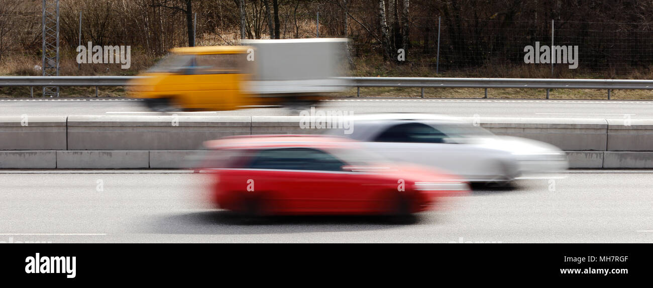 Side view of cars in motion on a freeway Stock Photo - Alamy