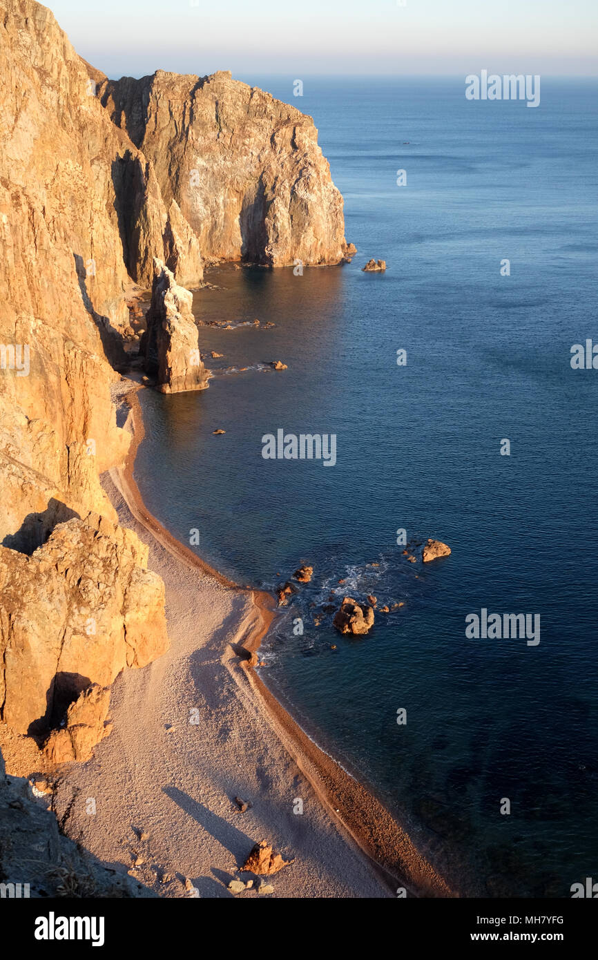 Wild rock beach at the sunset beautiful view Stock Photo - Alamy