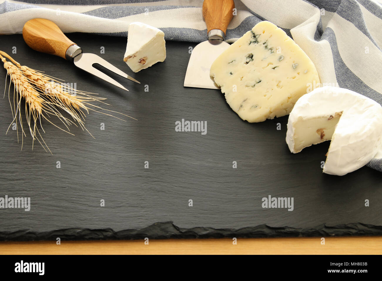 image of dairy products over black stone slate background. Symbols of ...