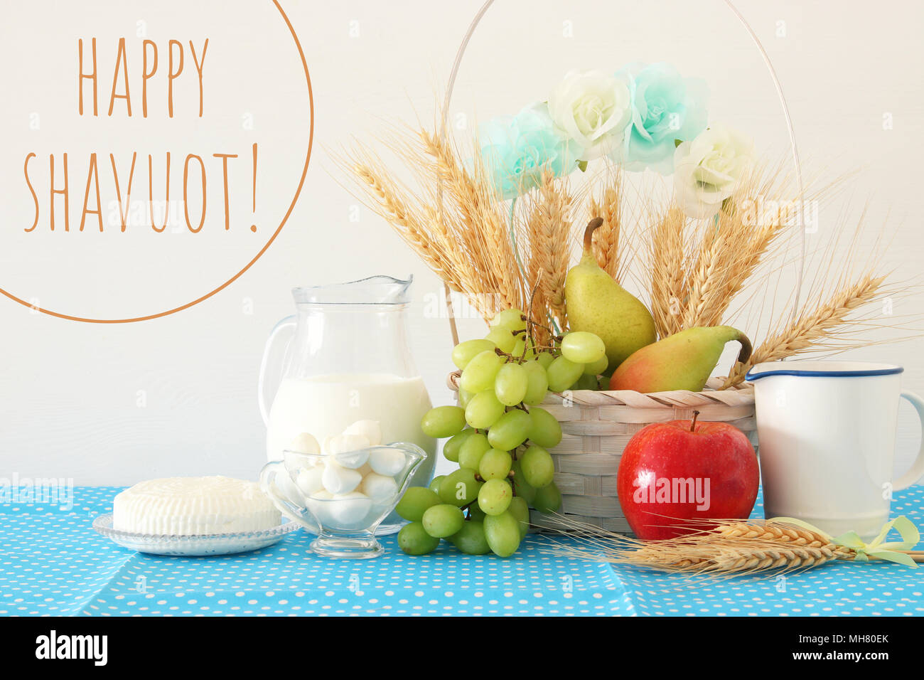 image of dairy products and fruits over wooden table. Symbols of jewish ...
