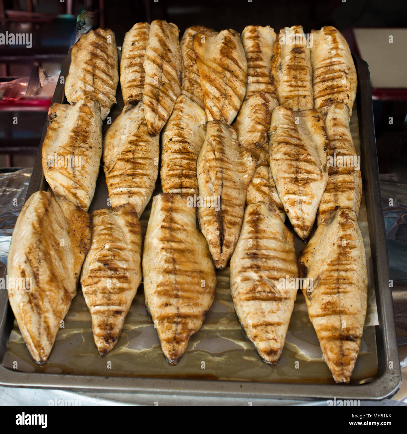 Fish on the grill as seafood ready to eat Stock Photo - Alamy