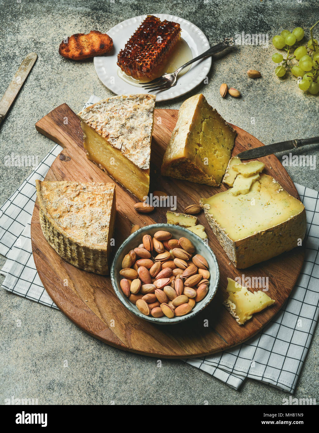 Cheese platter with cheese assortment and snacks Stock Photo - Alamy