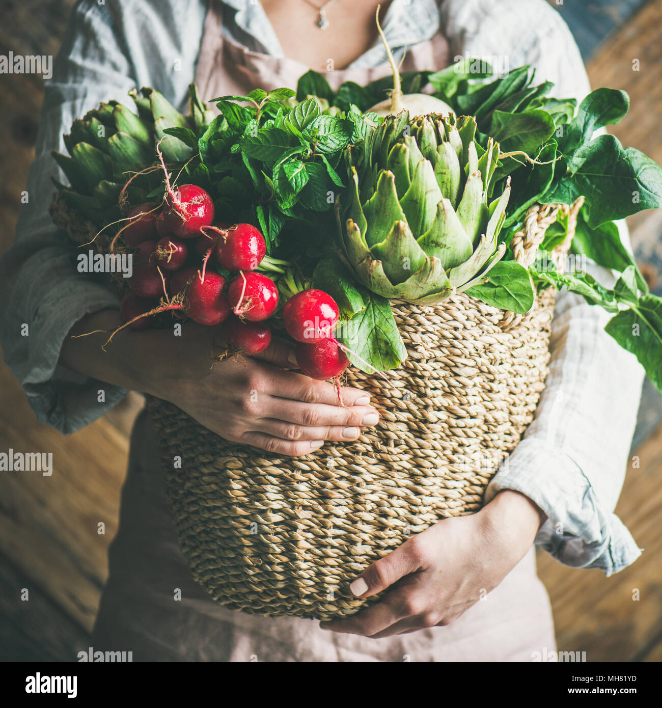 Female farmer holding basket with fresh vegetables, square crop Stock ...